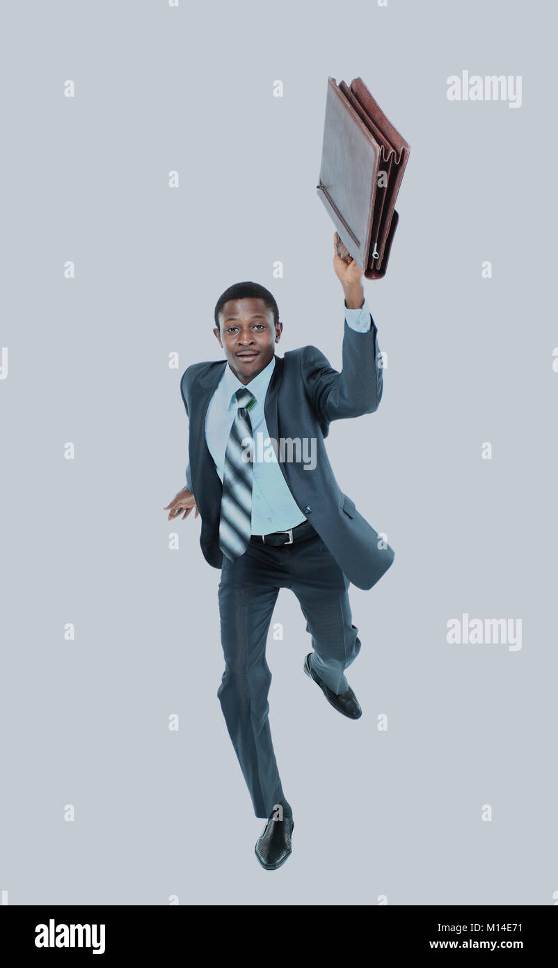 Businessman running with a briefcase, isolated on white background ...