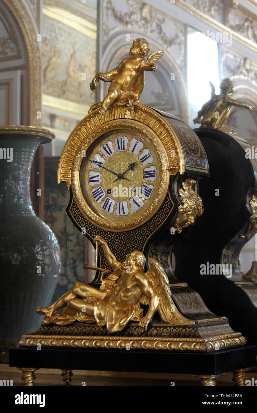 Golden clock in Versailles Palace, Ile-De-France, France Stock Photo ...