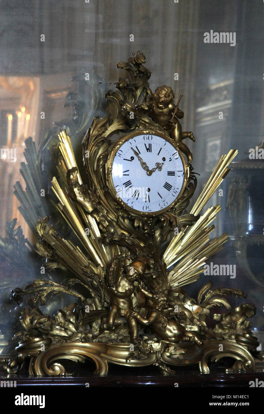 Close-up of antique French golden bronze monumental mantel clock ...