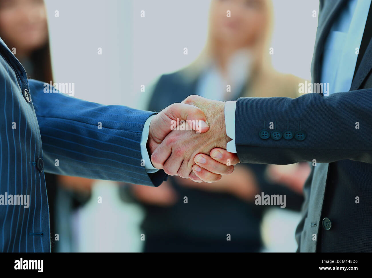 Business handshake. Business man giving a handshake to close the deal ...