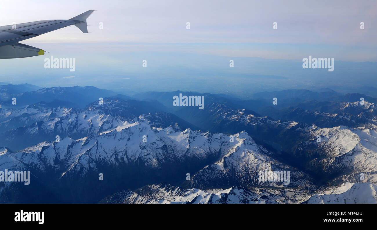 Snow-capped mountain peaks of the Alps to the altitude of the aircraft ...