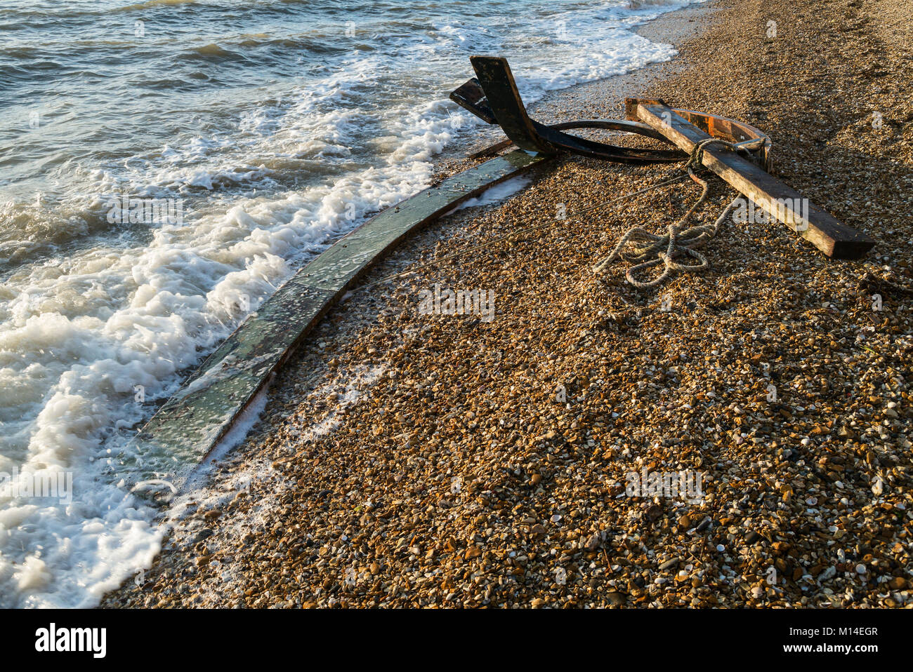 Storm debris washed up on the shingle beach at Meon Shore on the Solent ...