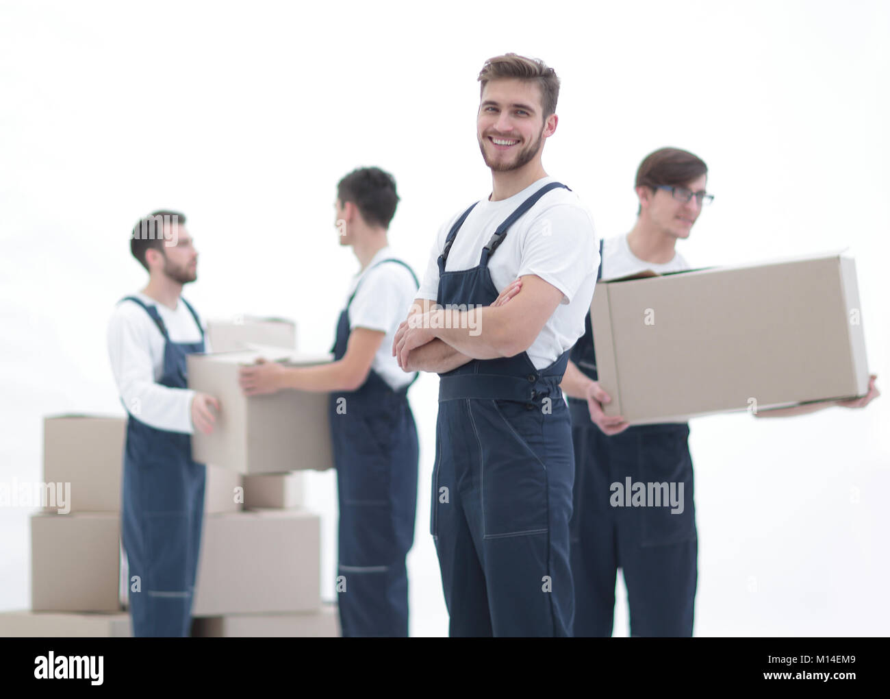 The team of responsible movers and their smiling leader Stock Photo - Alamy