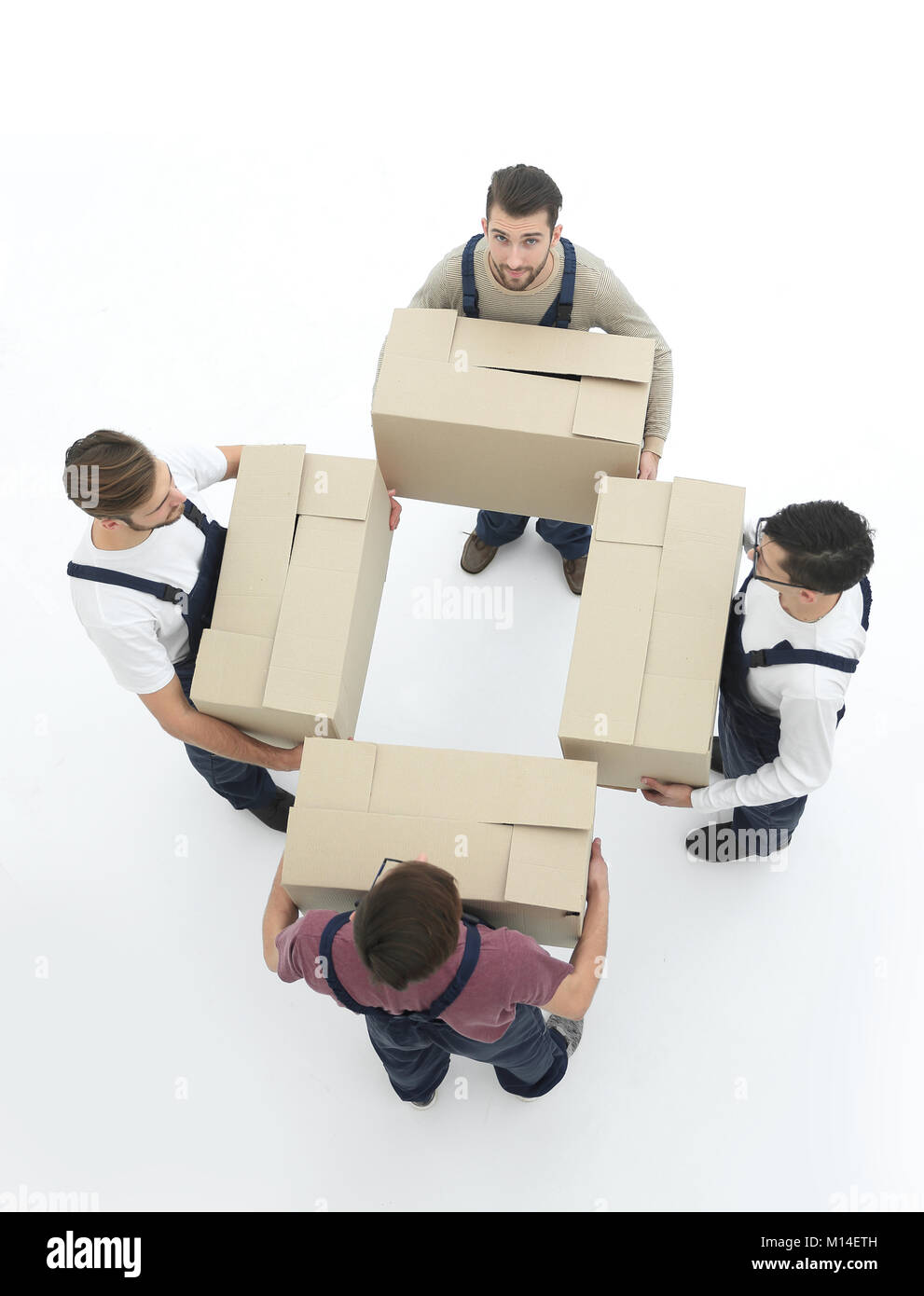 Movers lifting stack of cardboard moving boxes isolated on white Stock ...
