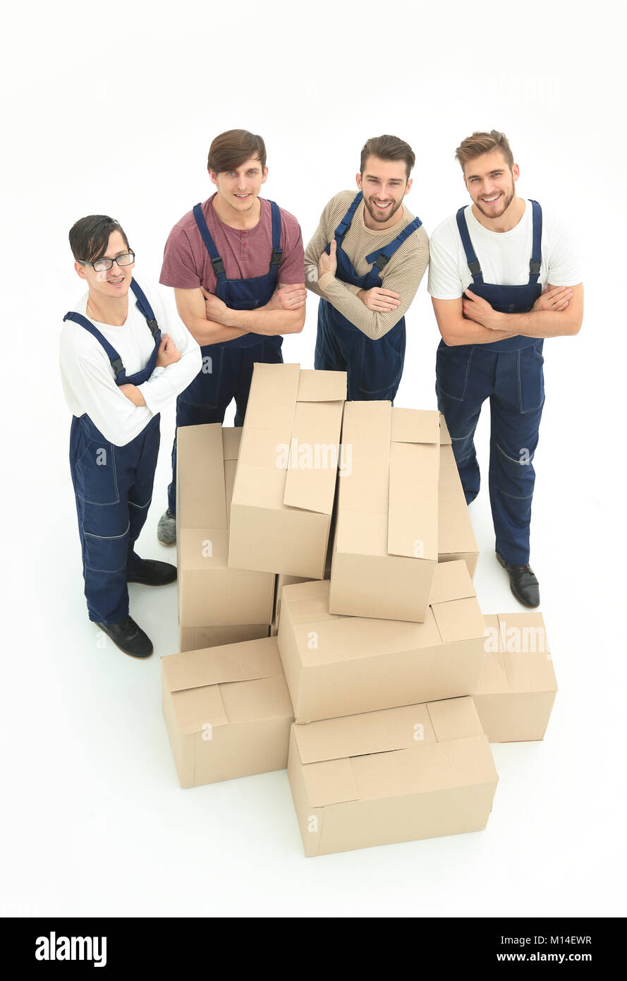 Cheerful loaders leaning on stack of boxes isolated on white background ...