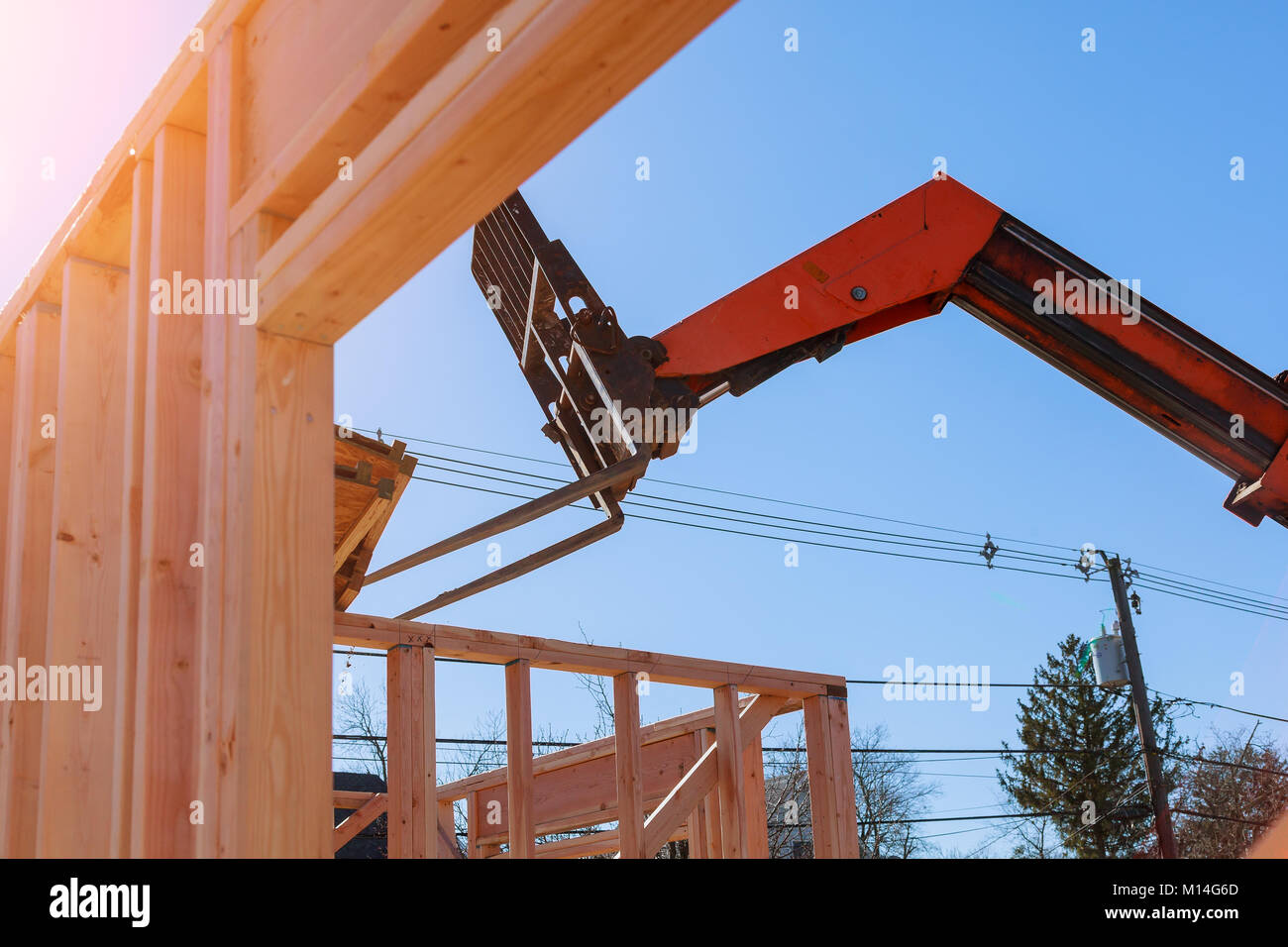 New residential building under construction with the crane about. Low ...