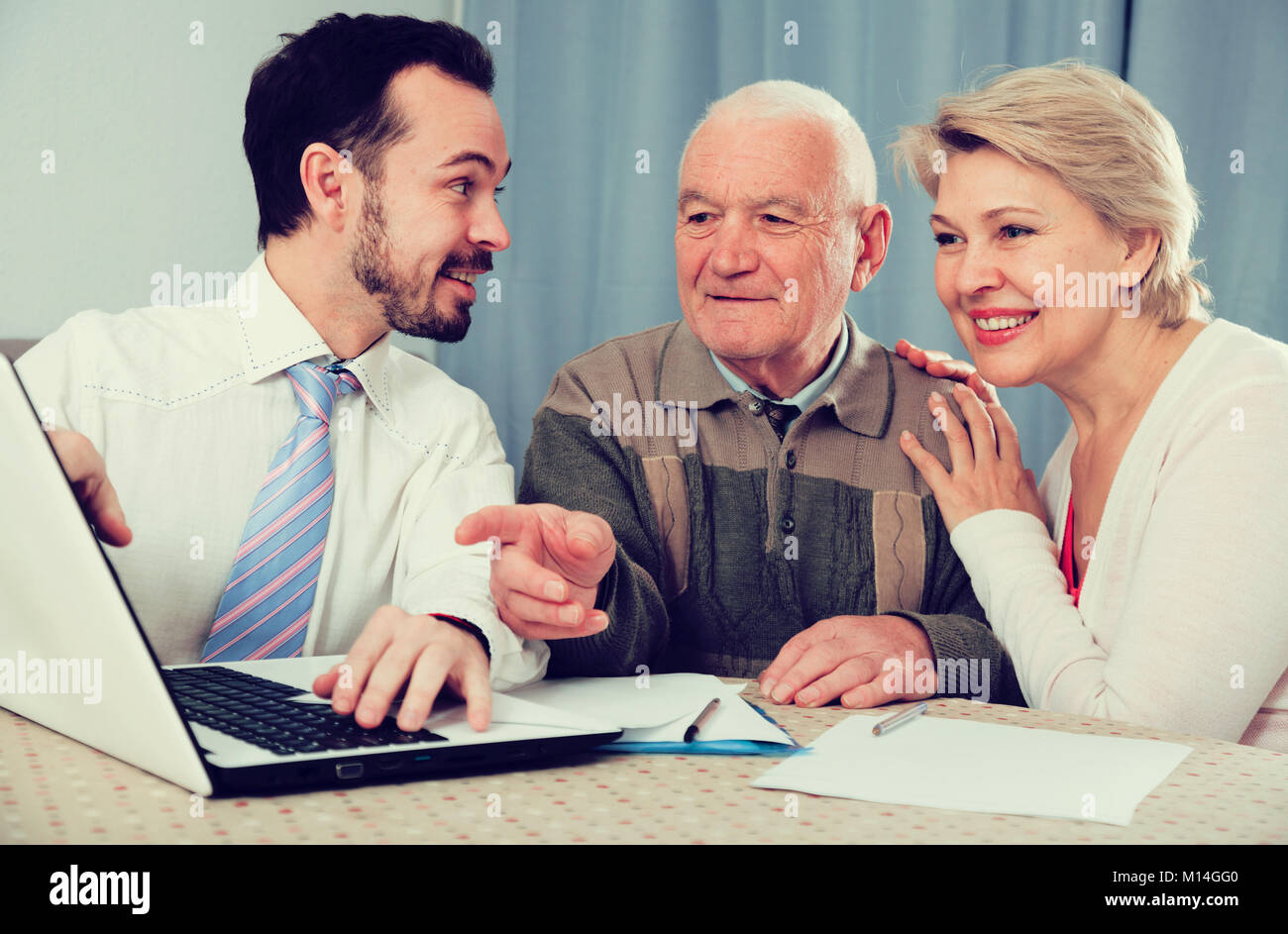 Father and mature daughter and young manager consider terms of contract ...