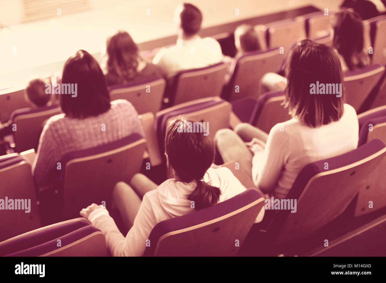 Number of people waiting for movie to start in cinema Stock Photo - Alamy
