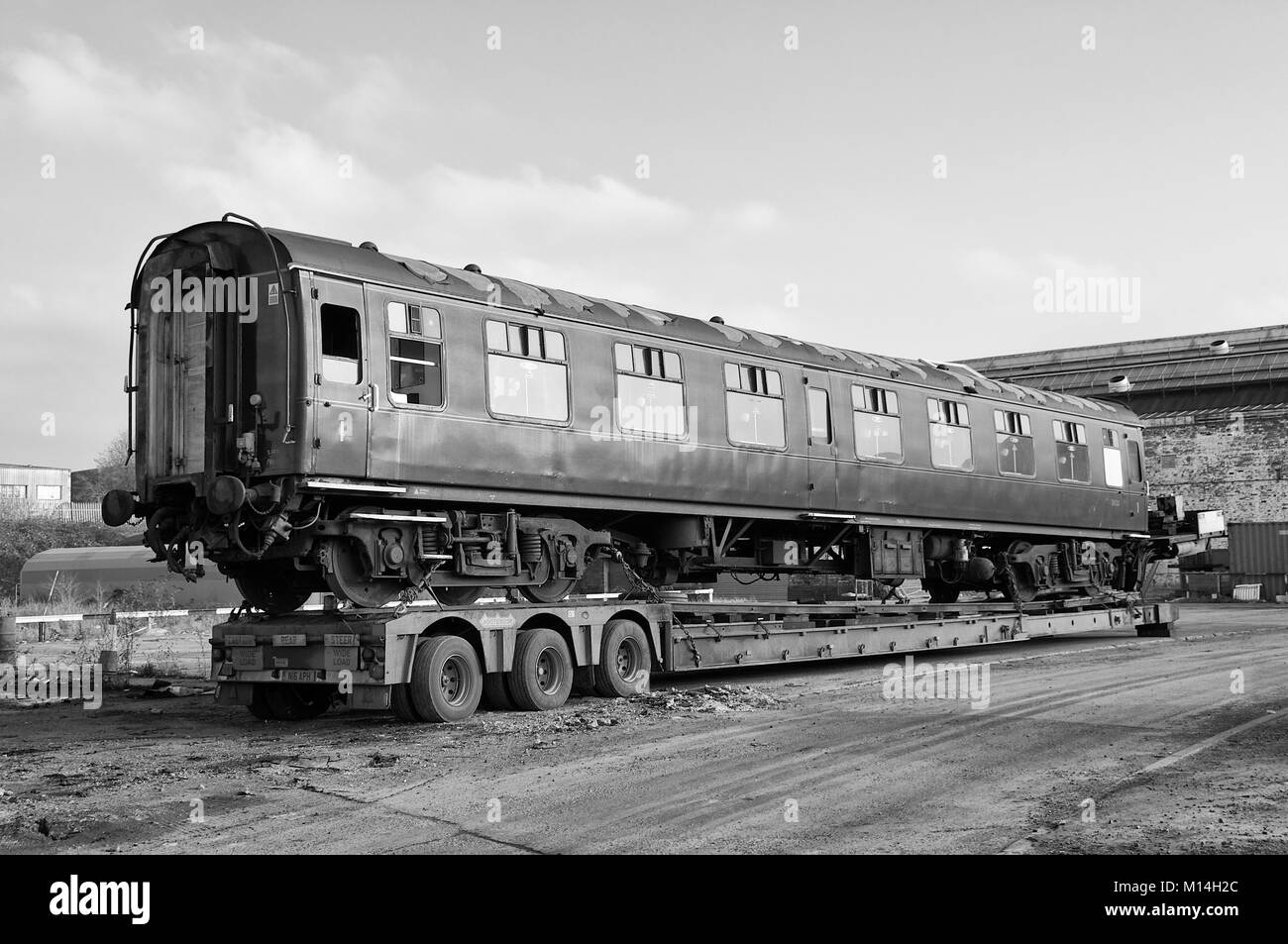 Railway carriage on a road trailer Stock Photo - Alamy