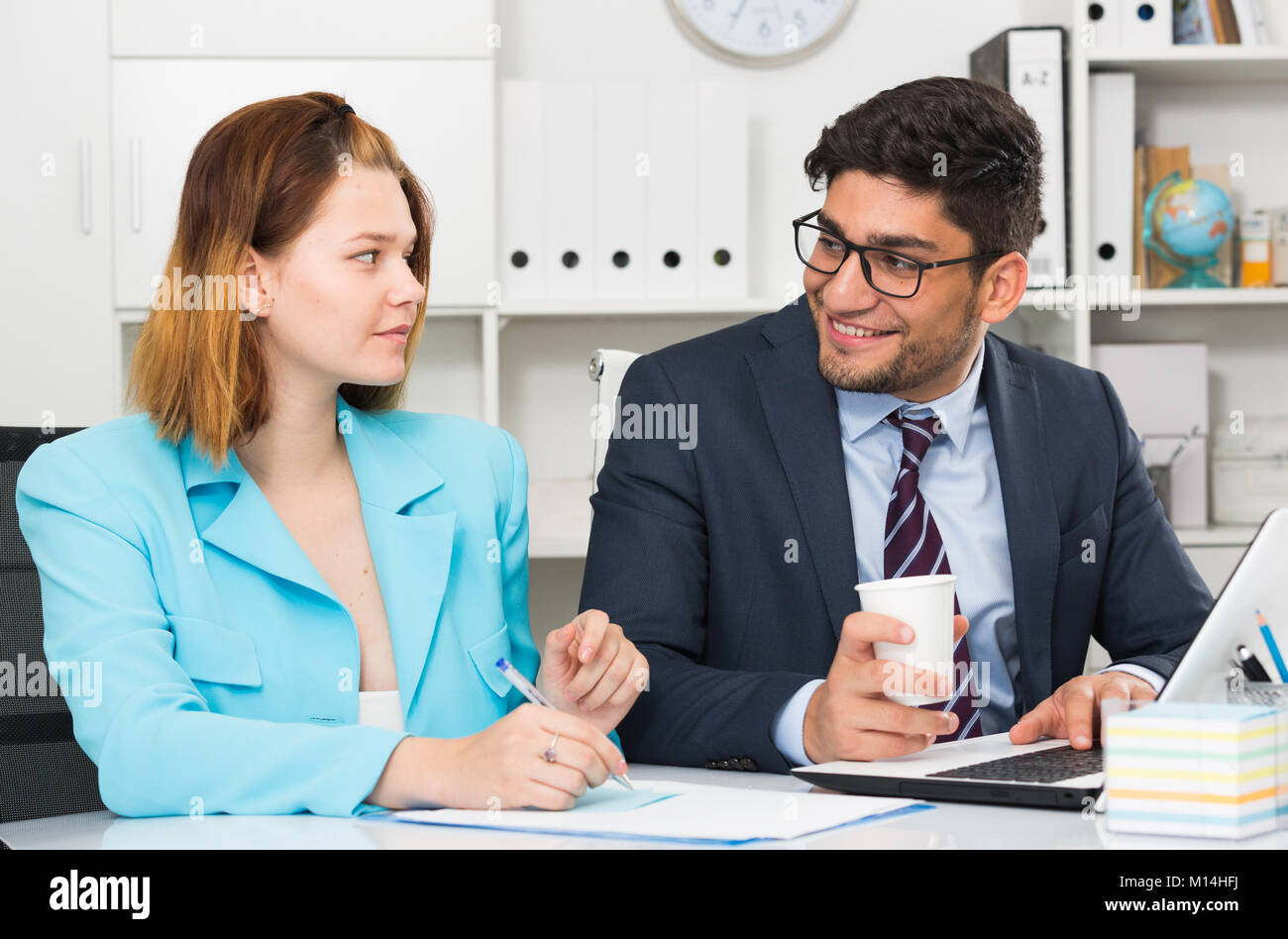 Two successful business partners working at meeting in office Stock ...