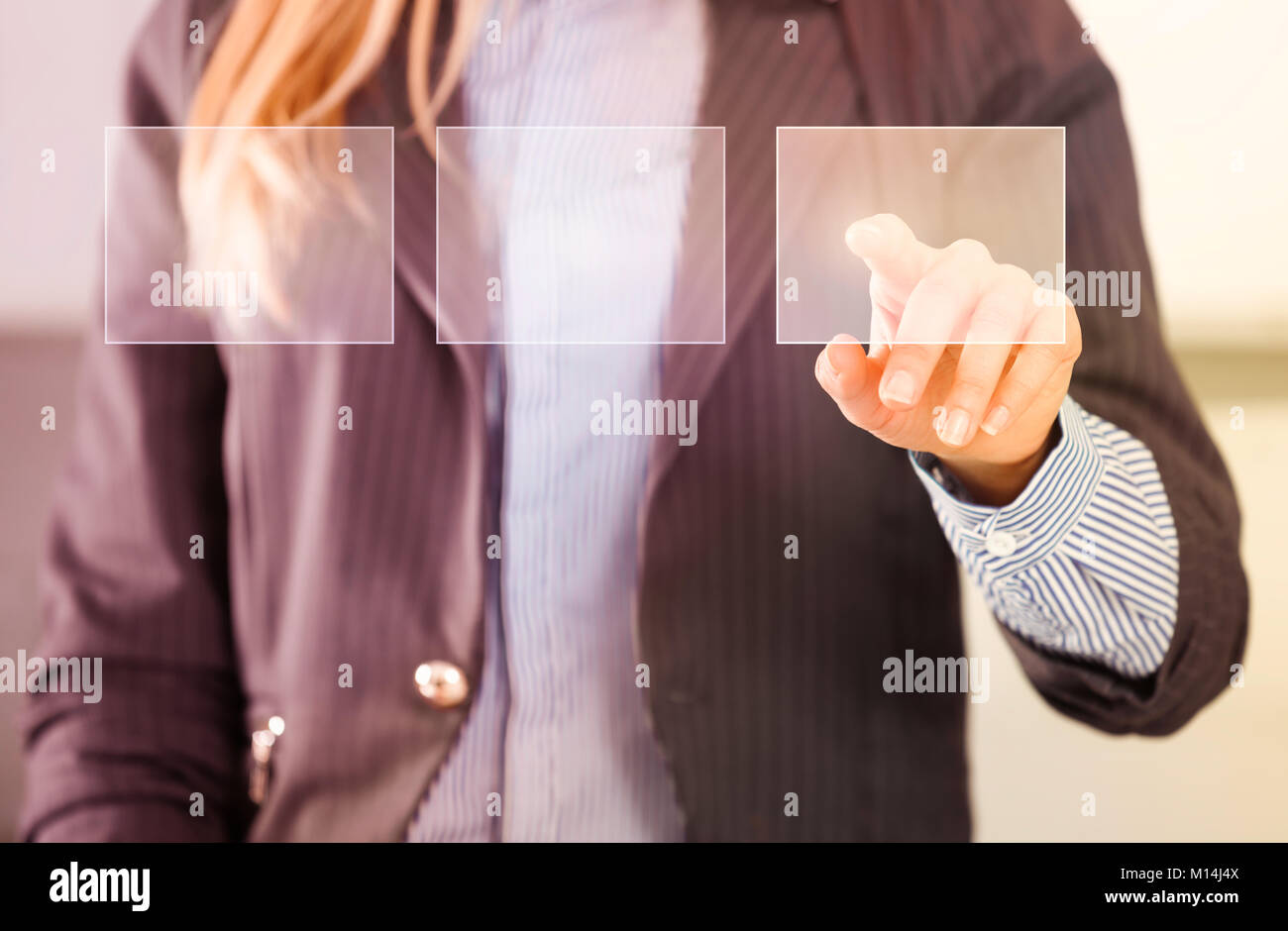 Woman touching screen on the background of modern glass buildings Stock ...