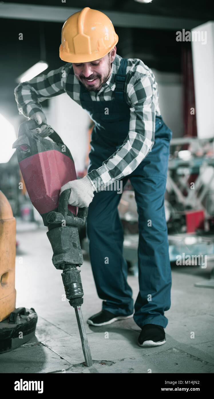 Construction using jackhammer drill hi-res stock photography and images ...