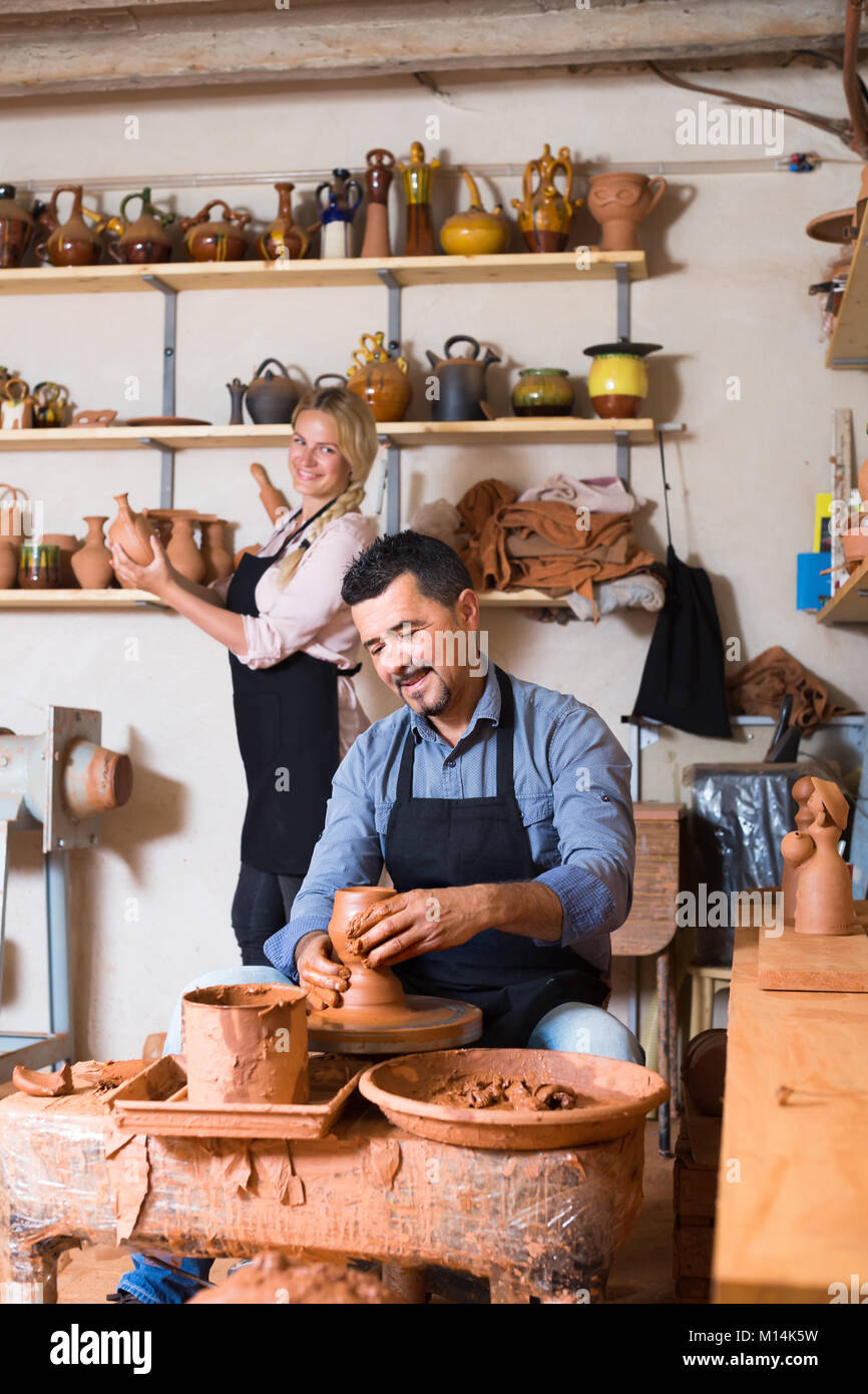 Two smiling potters in hi-res stock photography and images - Alamy