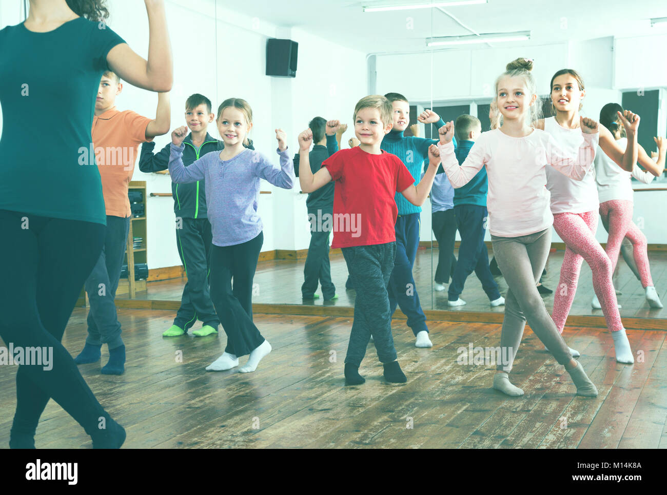 Friendly children dancing contemp in studio smiling and having fun ...