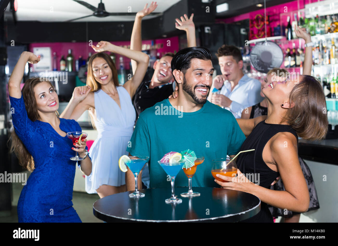 Man with woman are drinking cocktails on corporate party Stock Photo ...