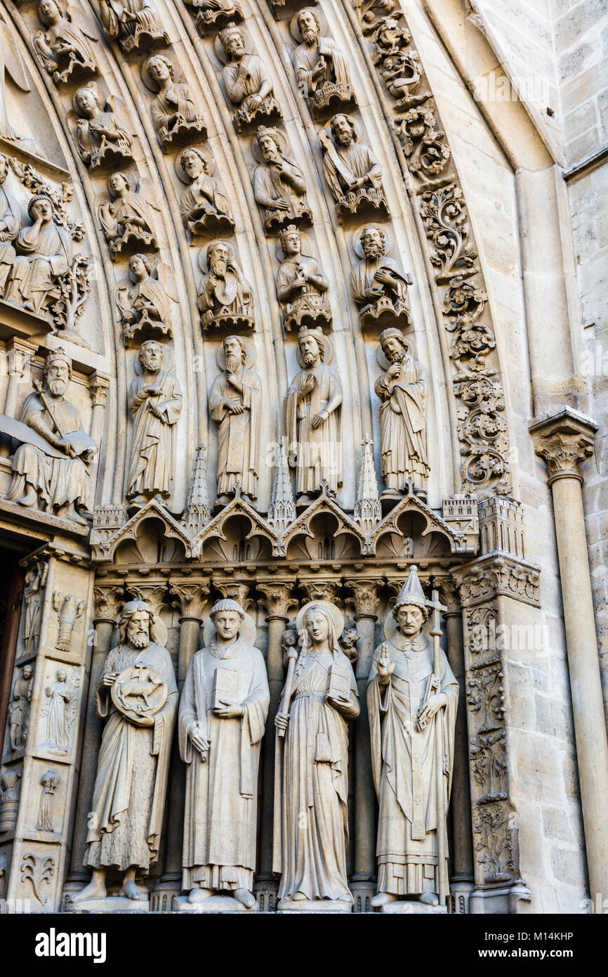 Paris, France: Statues of saints on the walls surrounding the doors of ...