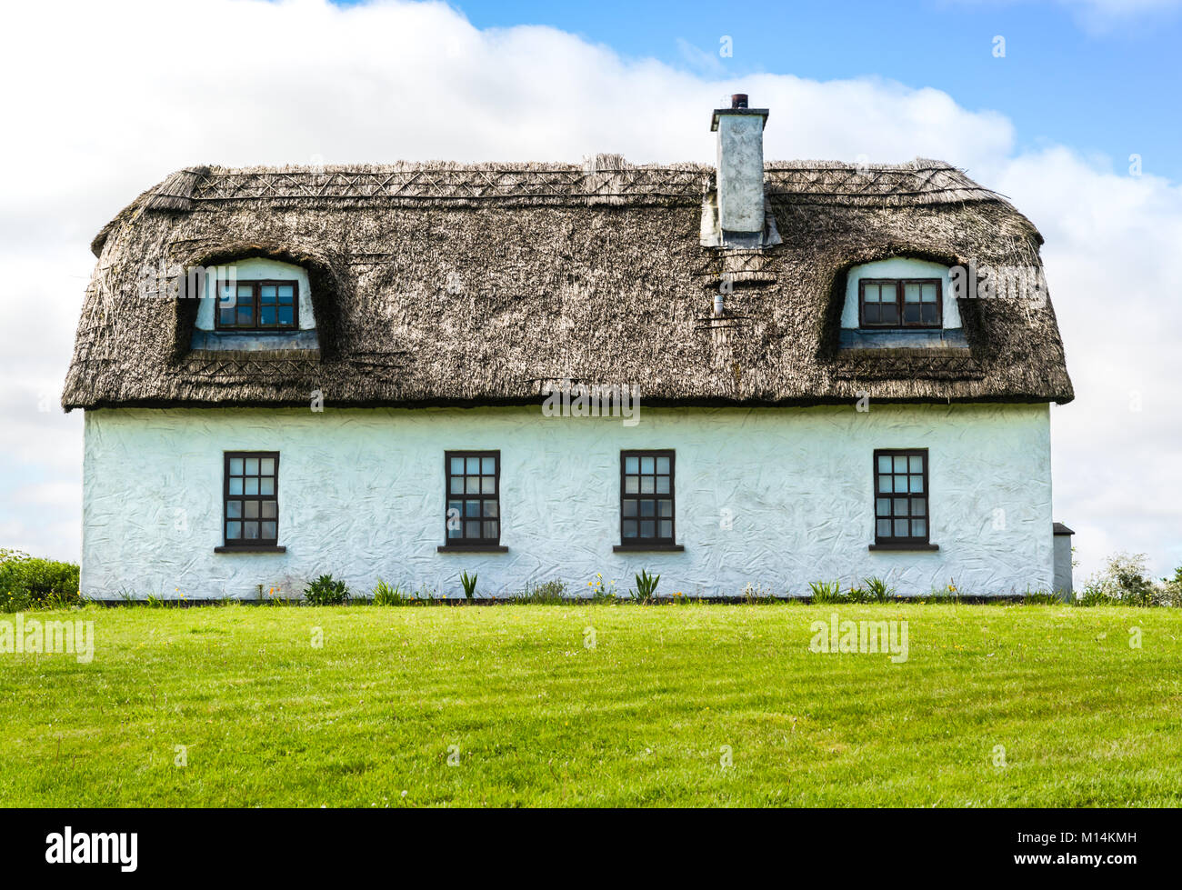 Traditional Irish country cottage house with thatch roof Stock Photo ...