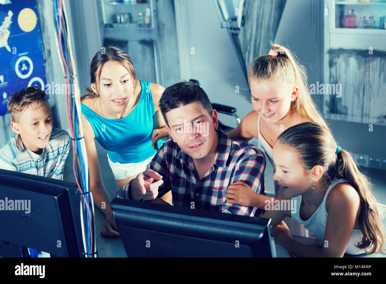 Portrait of family who is using computer in the lost room stylized ...