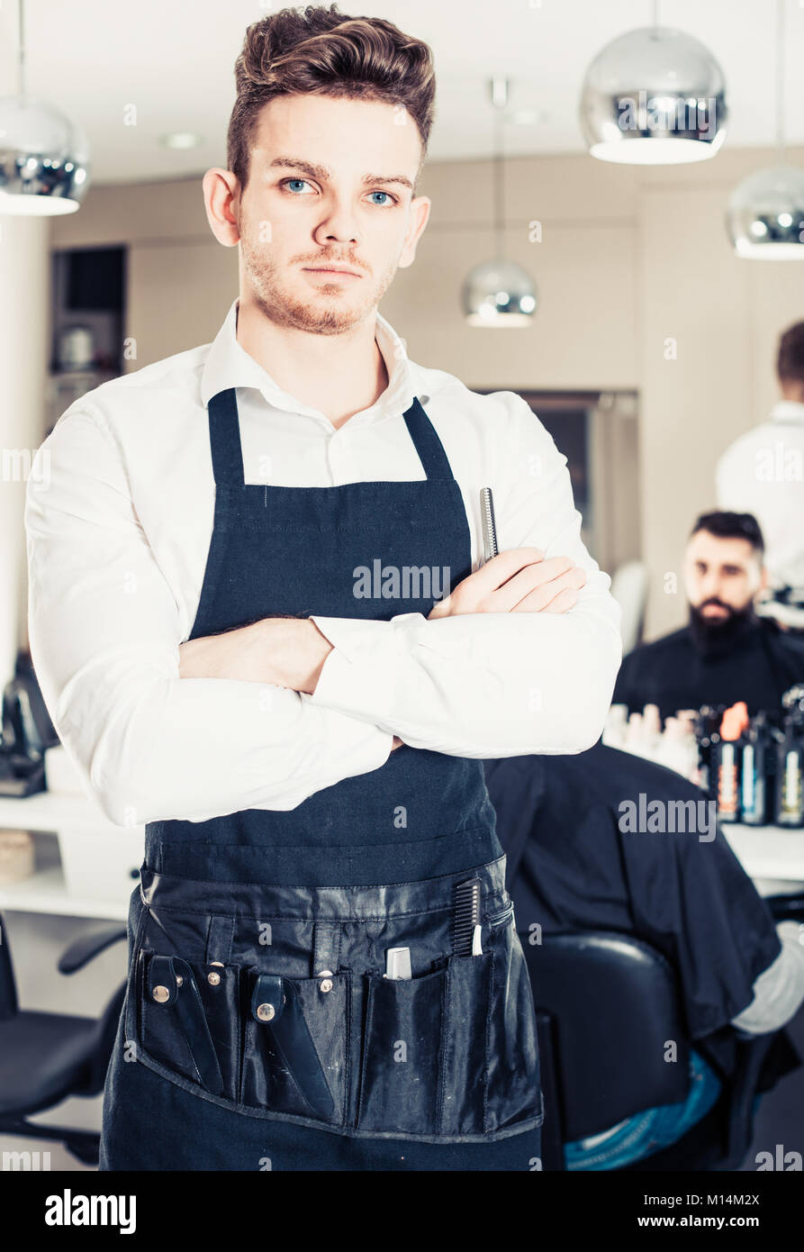 guy displaying his workplace and tools at hairdressing salon Stock ...
