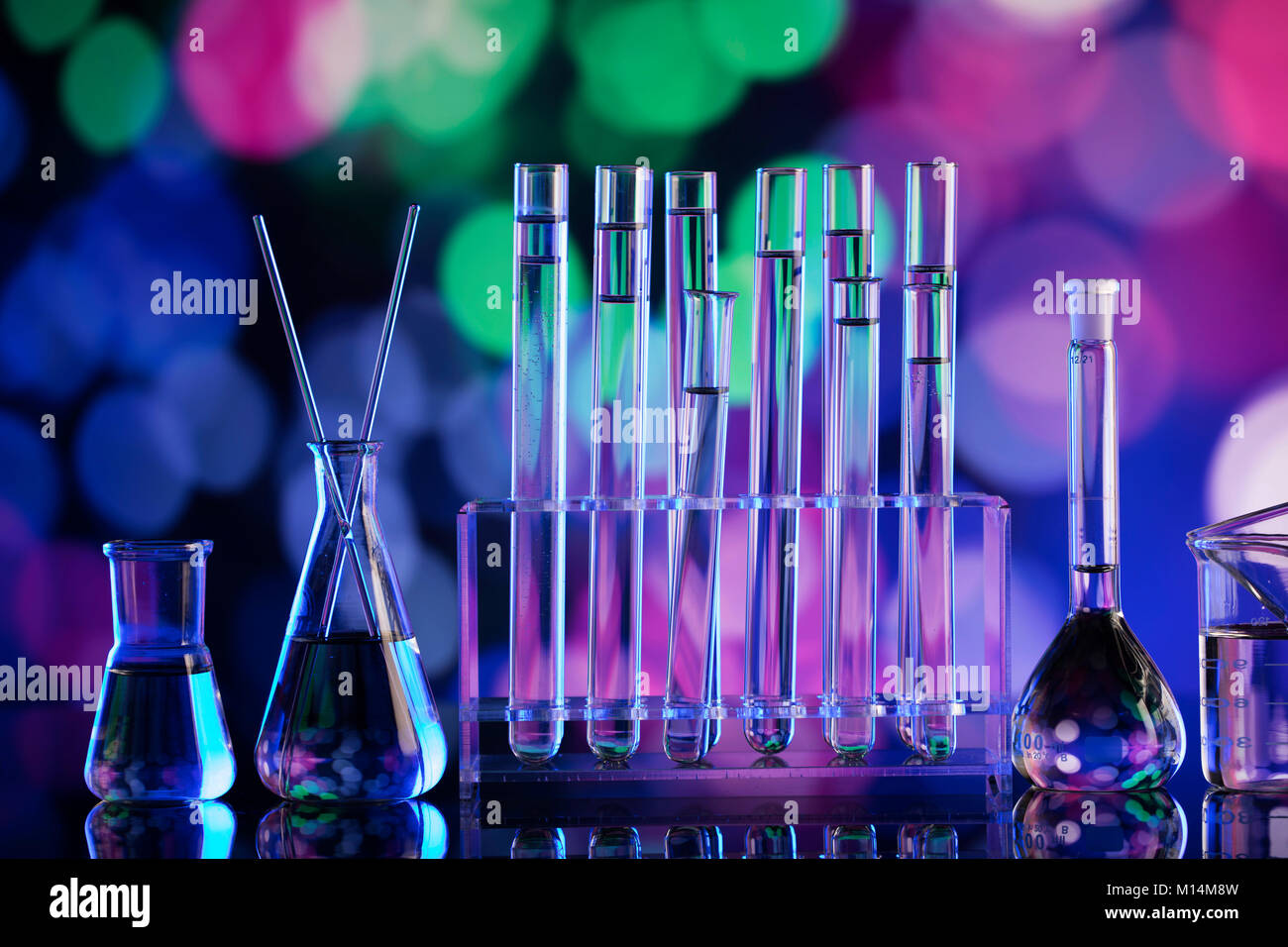Science experiment concept background. Laboratory beakers, pipette ...