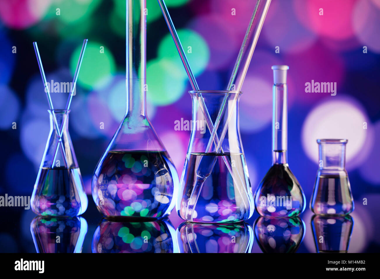 Science experiment concept background. Laboratory beakers, pipette ...