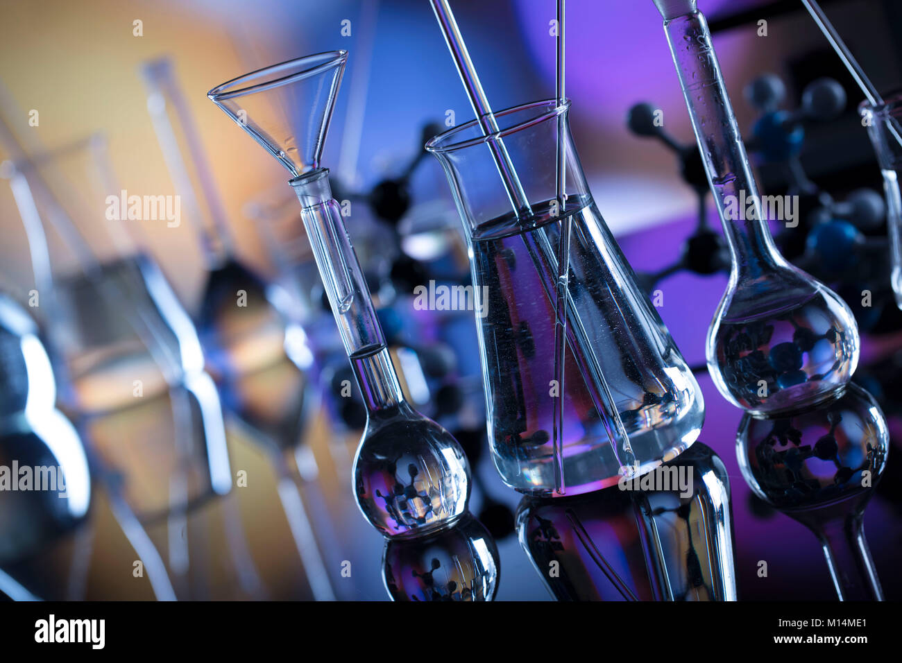 Science experiment concept background. Laboratory beakers, pipette ...