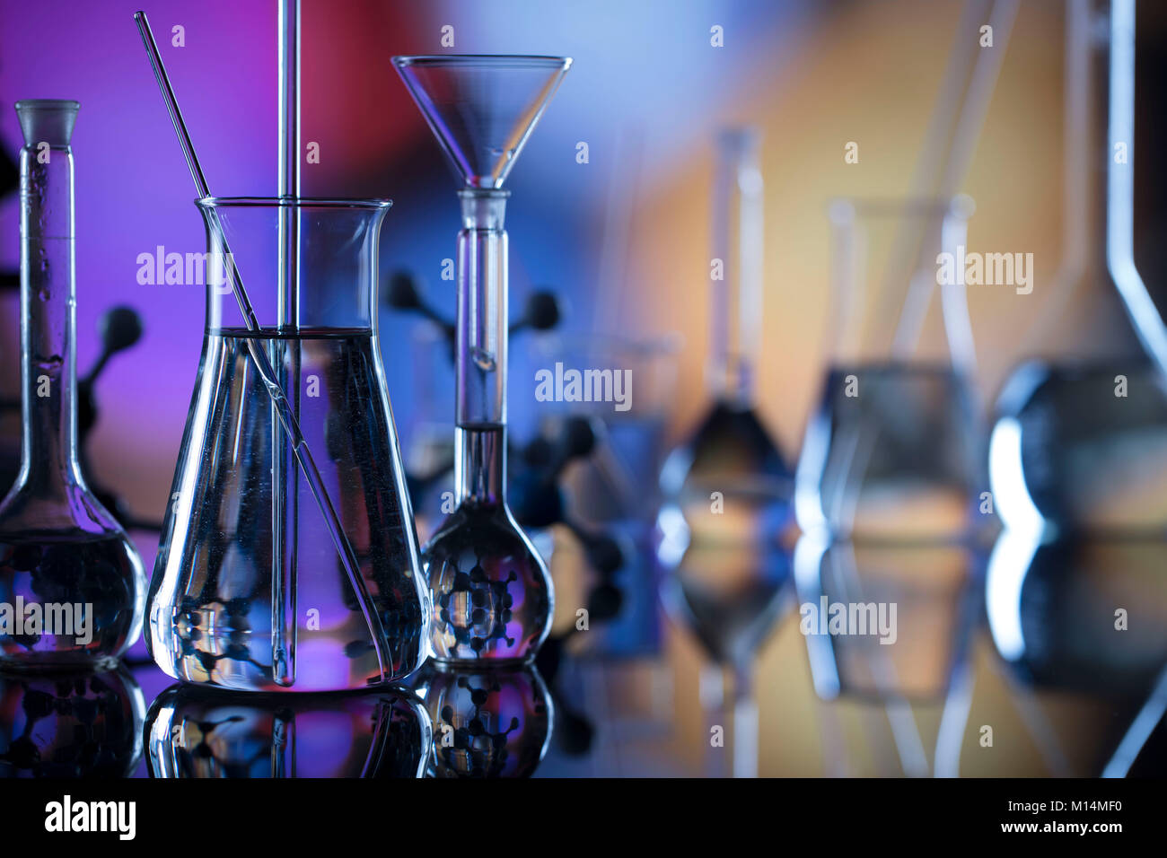 Science experiment concept background. Laboratory beakers, pipette ...