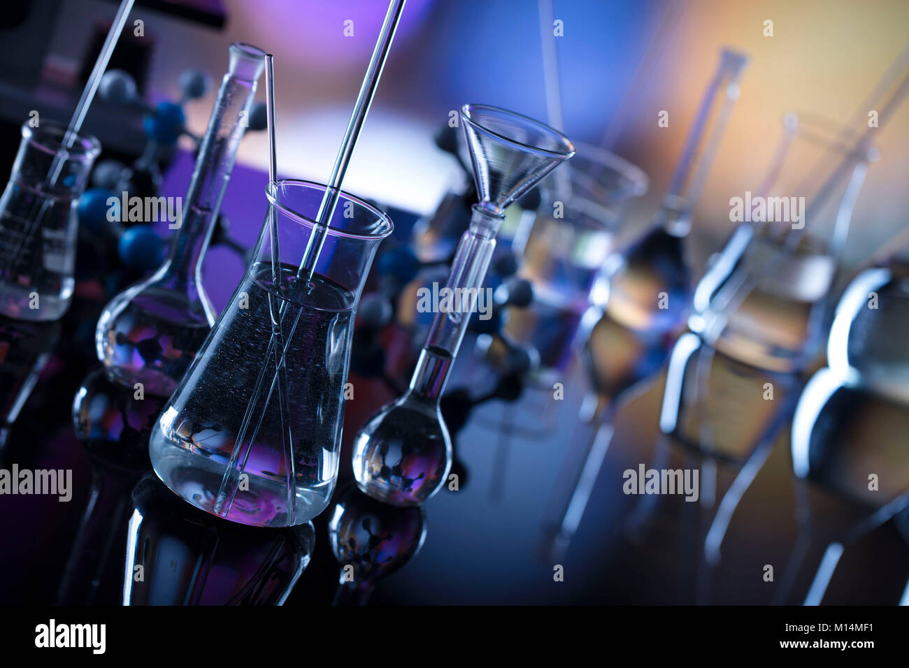 Science experiment concept background. Laboratory beakers, pipette ...