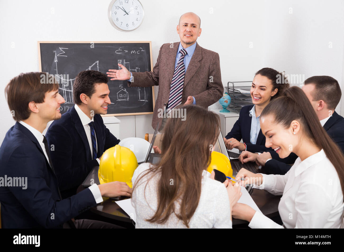 Successful architects engineers discussing hi-res stock photography and ...