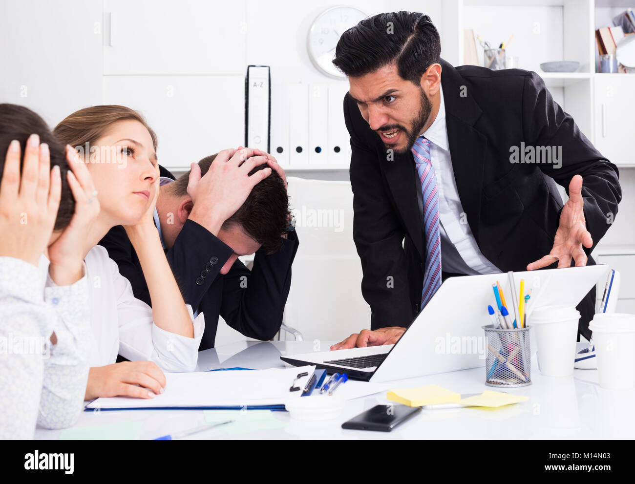 Outraged manager expressing dissatisfaction with teamwork of colleagues ...