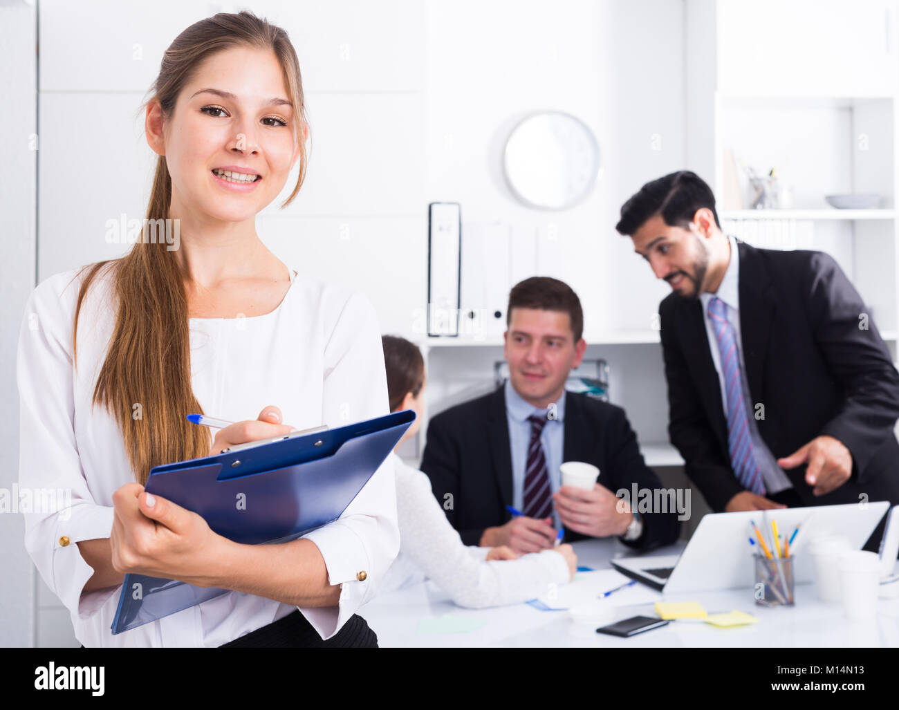 Elegant business woman writing down ideas and tasks on background with ...