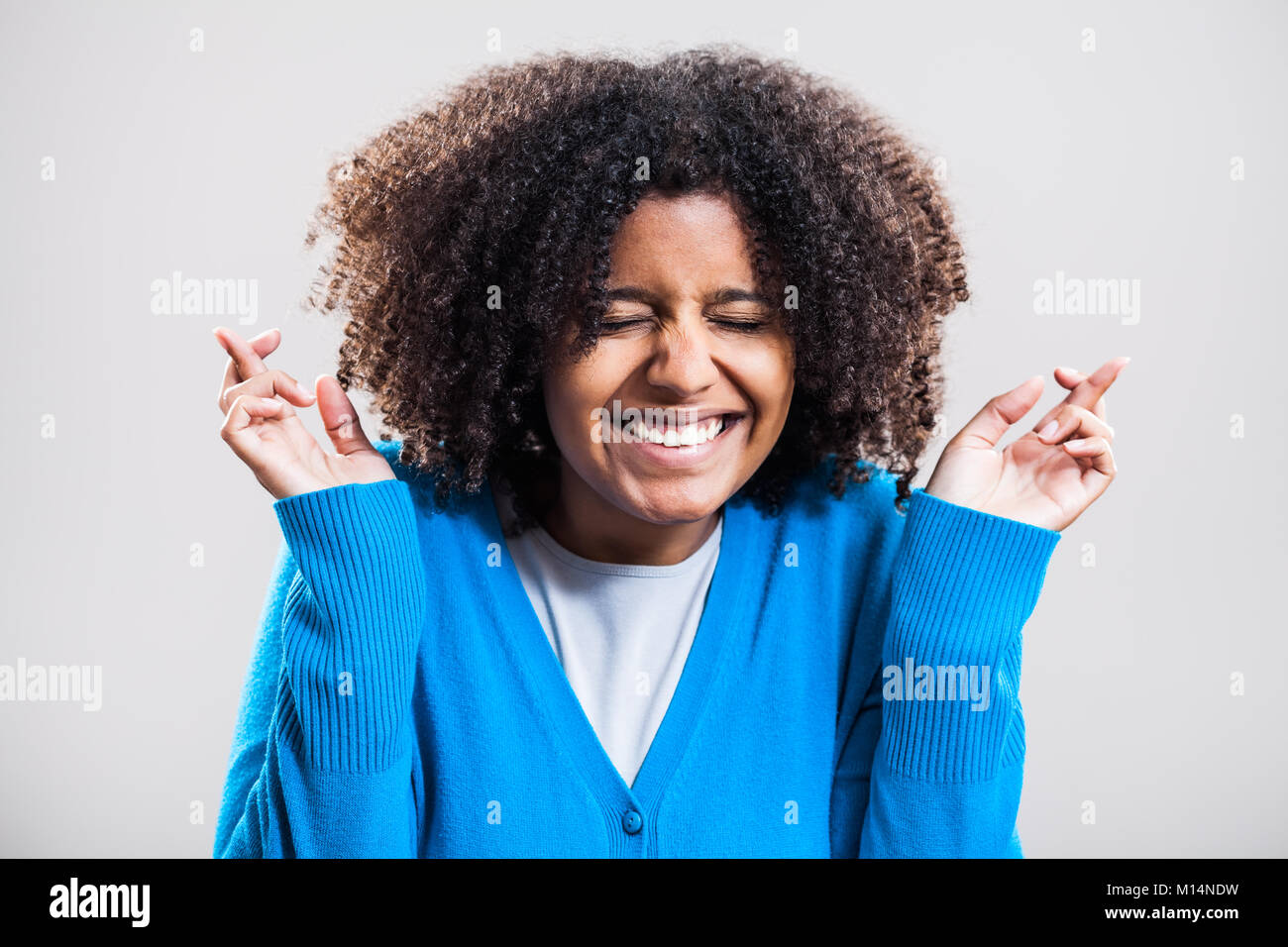 Happy finger crossed hi-res stock photography and images - Alamy