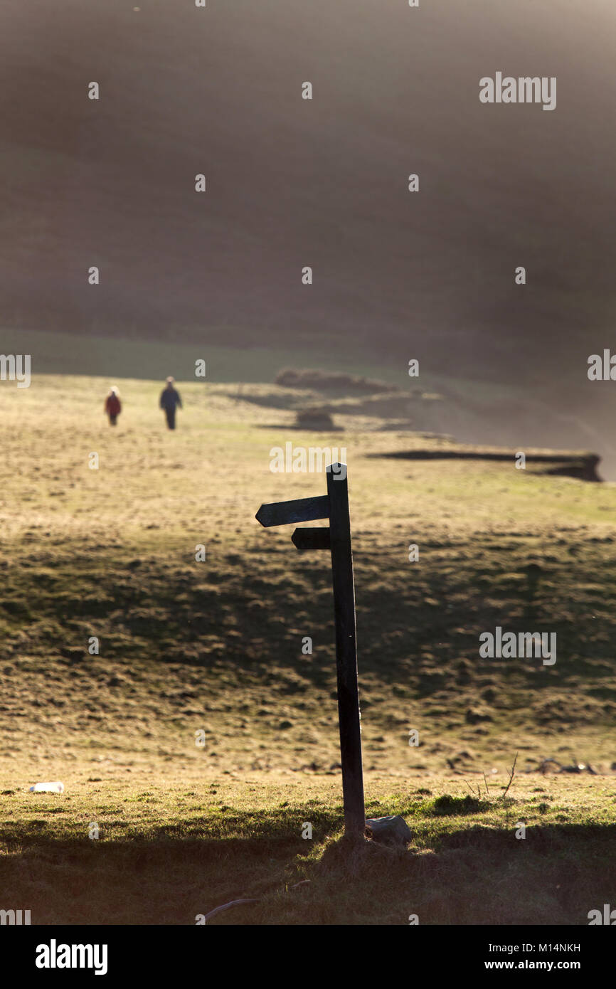 The Wales Coast Path. Silhouetted view of a route sign on the Wales and ...