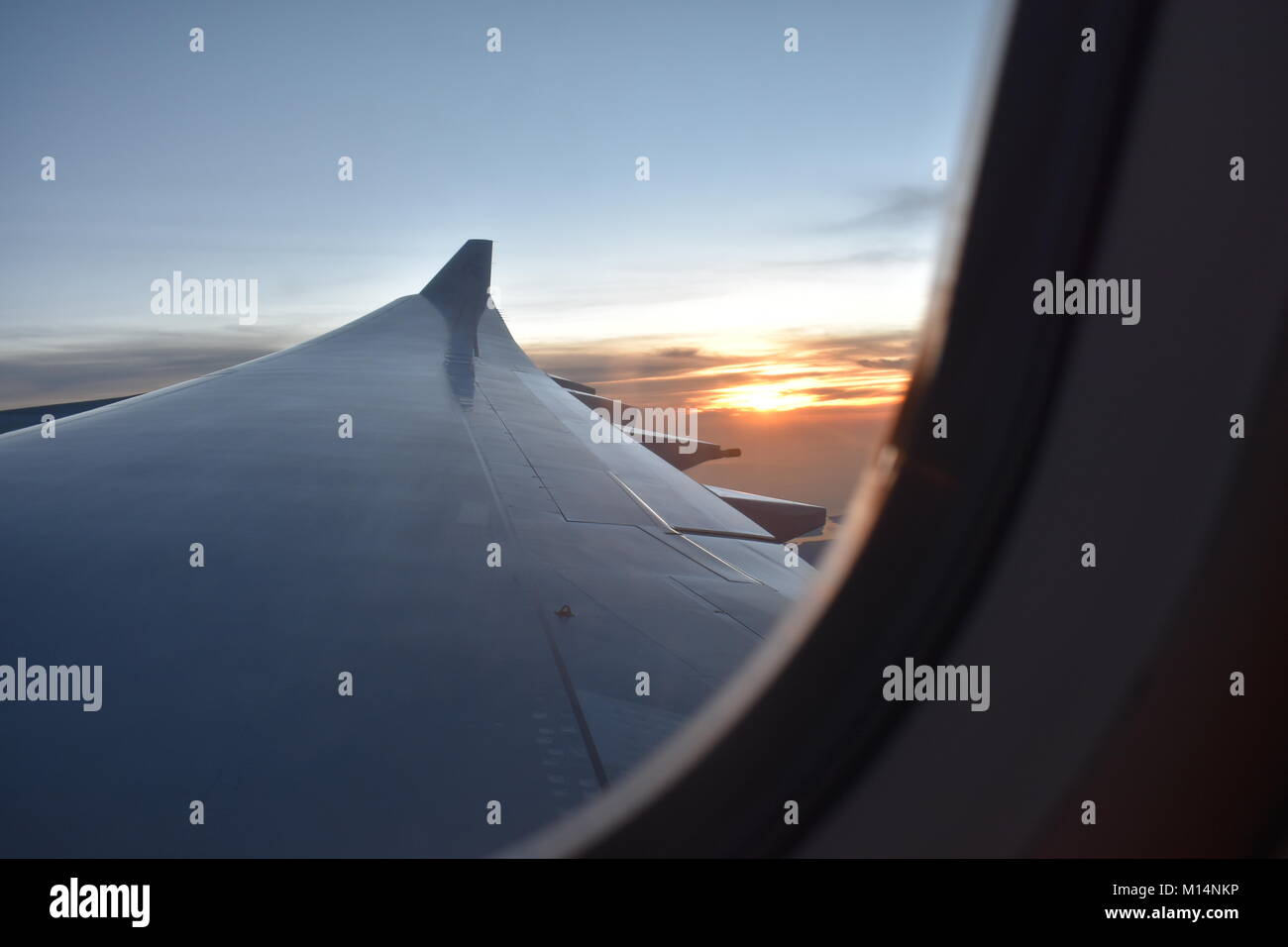 Sunset from a plane Stock Photo - Alamy