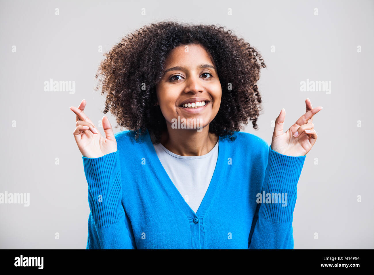 Happy finger crossed hi-res stock photography and images - Alamy