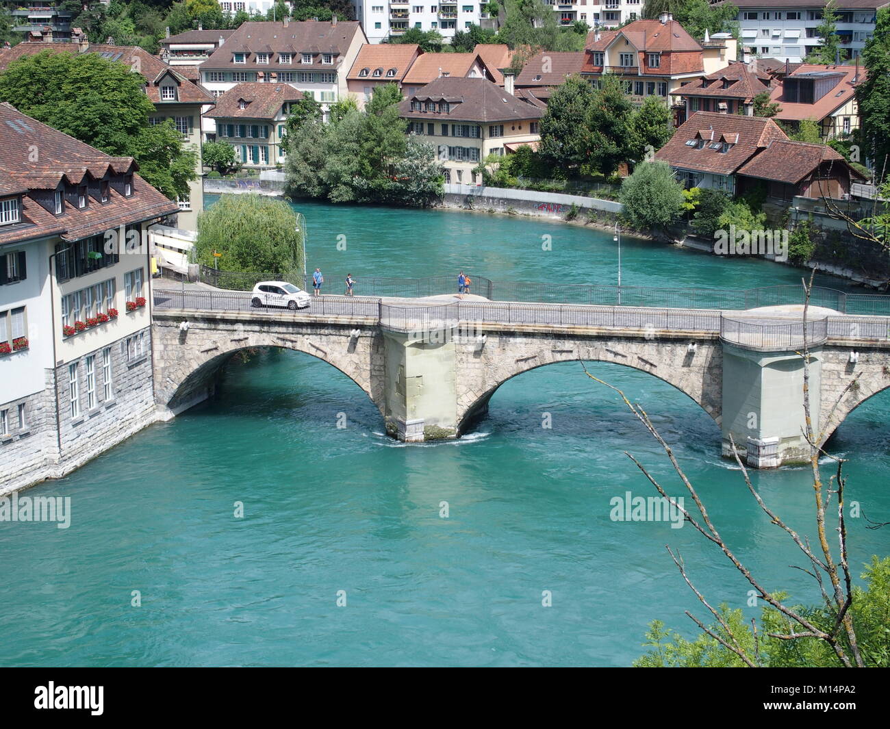 BERN BERNE, SWITZERLAND, bridge over clean alpine Aare river with clean ...