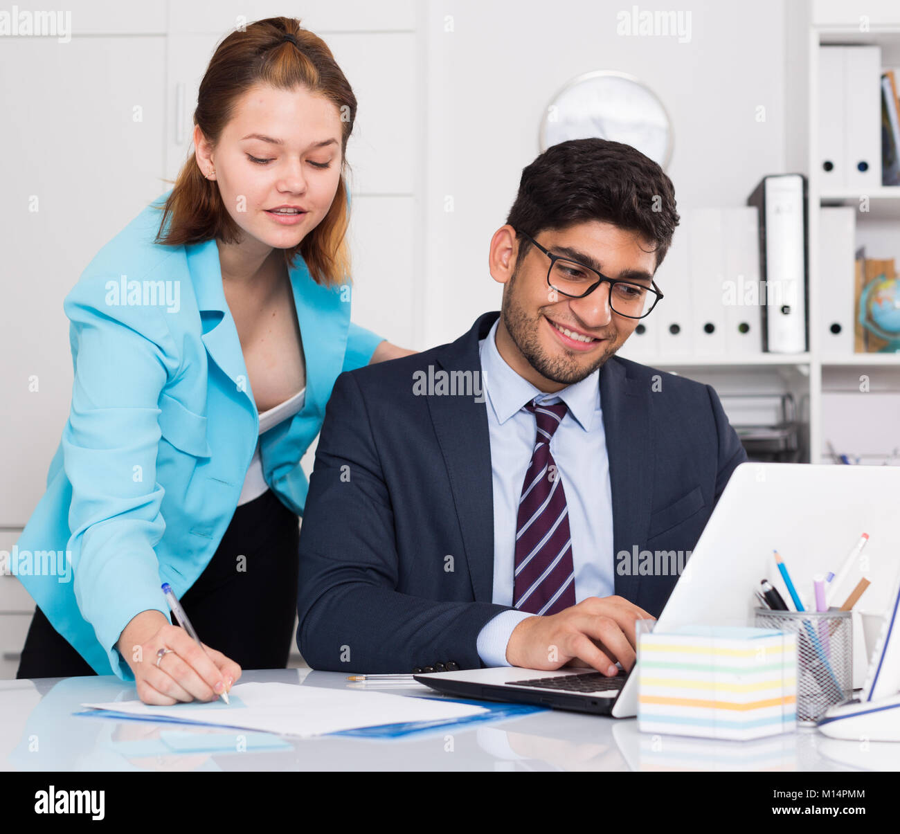 Focused business team working with computer in modern office Stock ...