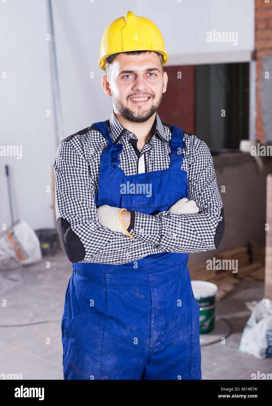 Portrait of builder which is doing repair at home Stock Photo - Alamy
