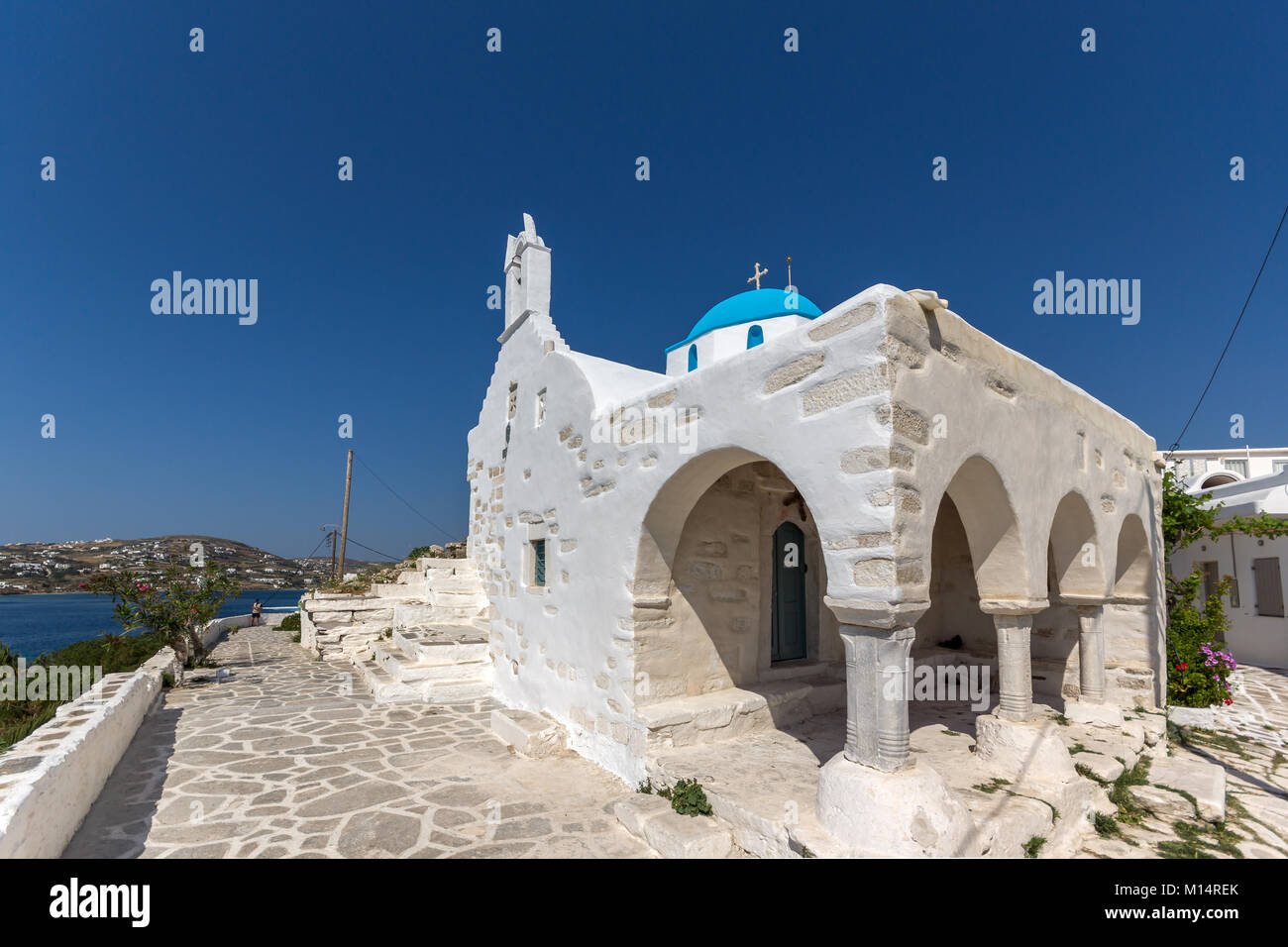 White chuch with blue roof in town of Parakia, Paros island, Cyclades ...