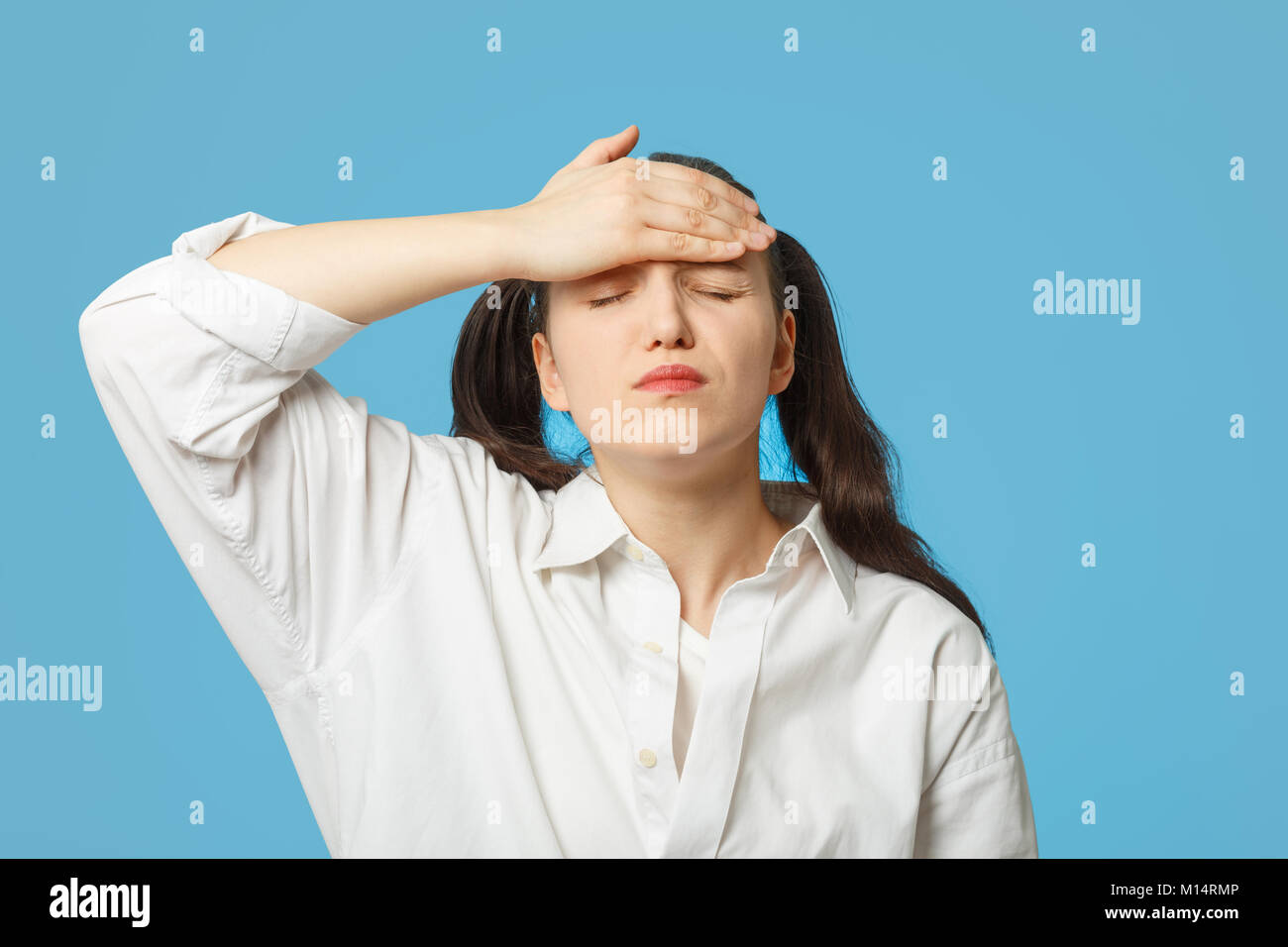 Hand touching forehead hi-res stock photography and images - Alamy
