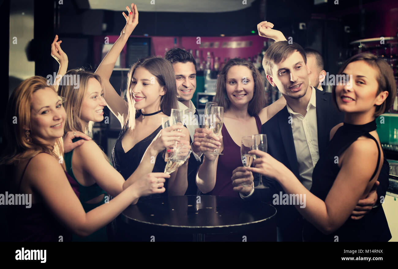 Smiling colleagues dancing on corporate party with cocktails Stock ...