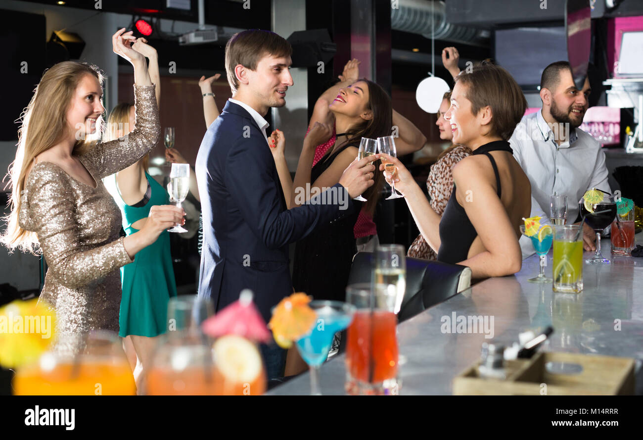 People are talking and dancing on the corporate event in bar Stock ...
