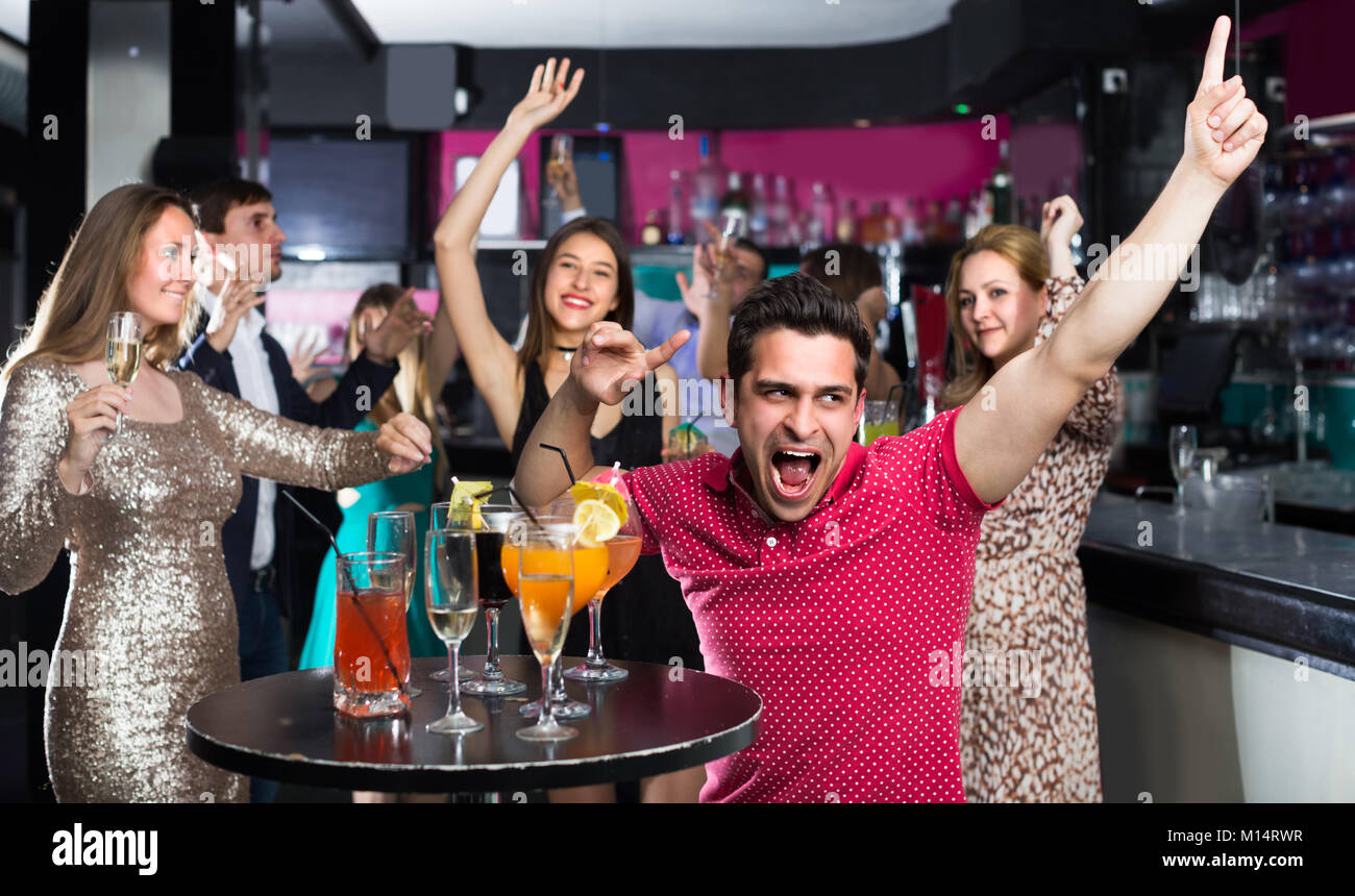 Student guy is dancing on party in the bar Stock Photo - Alamy