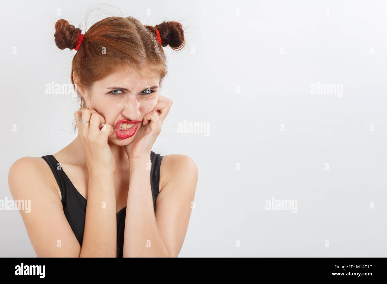 stressed sad girl on white background looking at camera Stock Photo - Alamy
