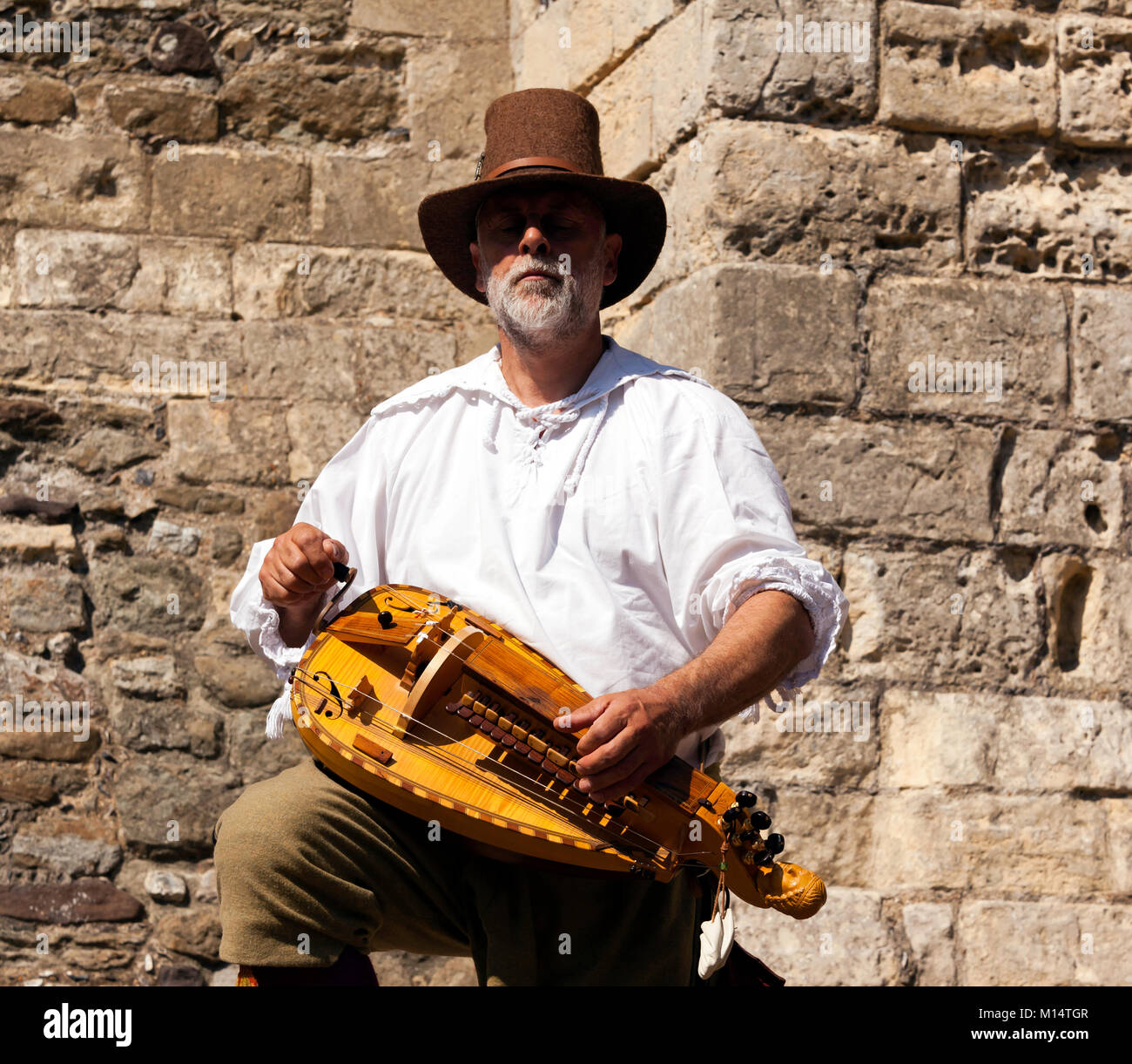 Tudor minstrel playing a Hurdy-gurdy, at Dover Castle Stock Photo - Alamy