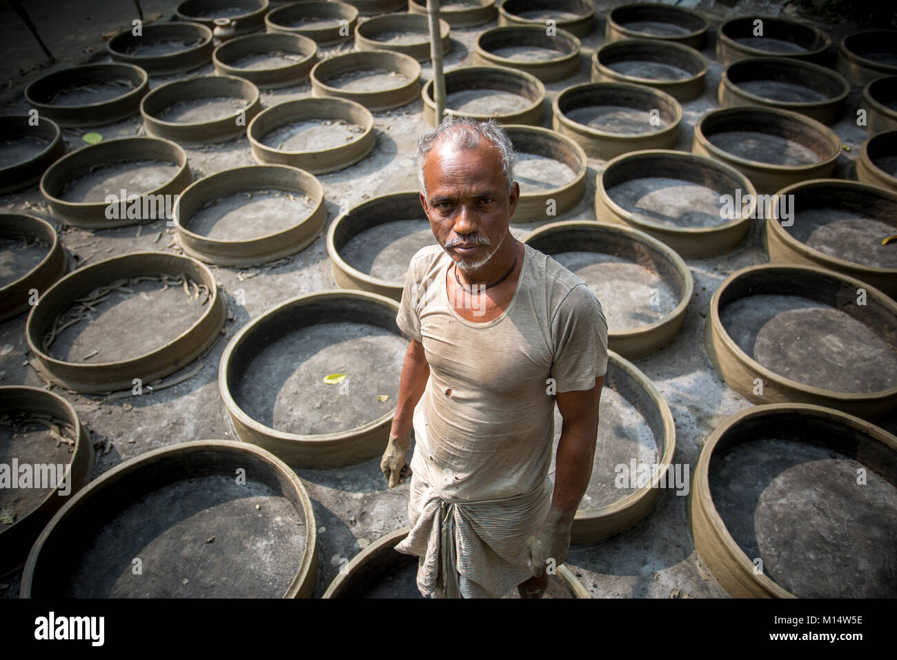 A potter Guru Poddo Pal working on this profession 40 years almost ...