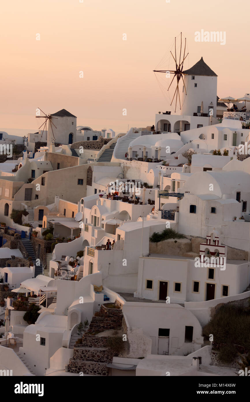 Amazing Sunset over white windmills in town of Oia and panorama to ...
