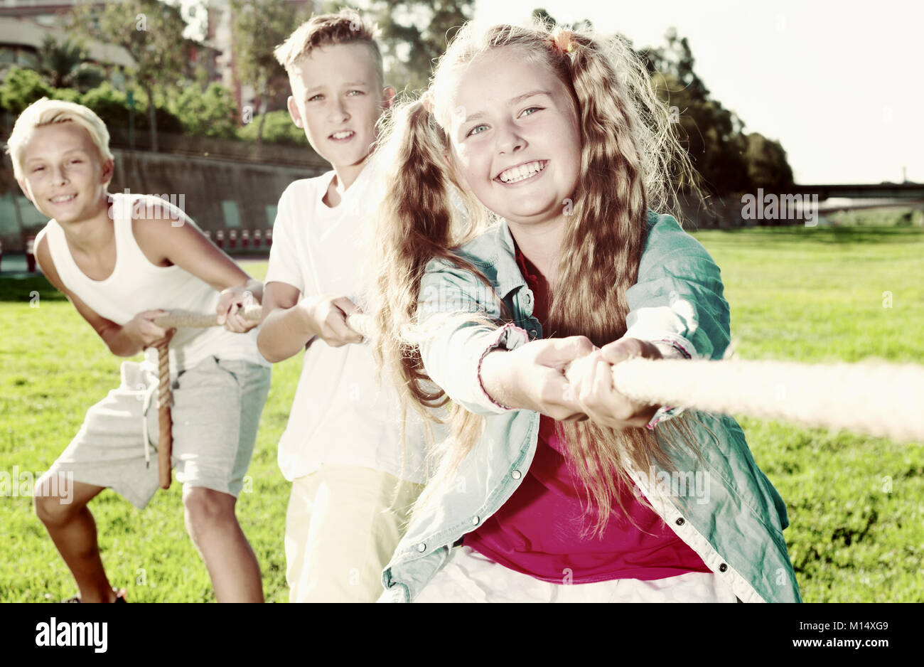 Tugging kids hi-res stock photography and images - Alamy