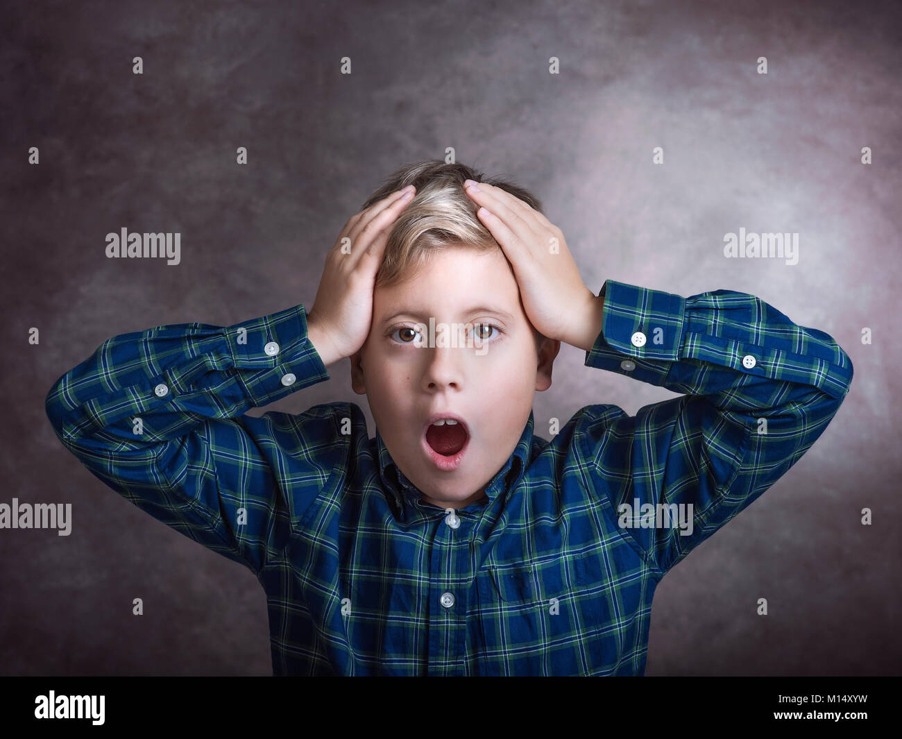 Young boy surprised Stock Photo - Alamy