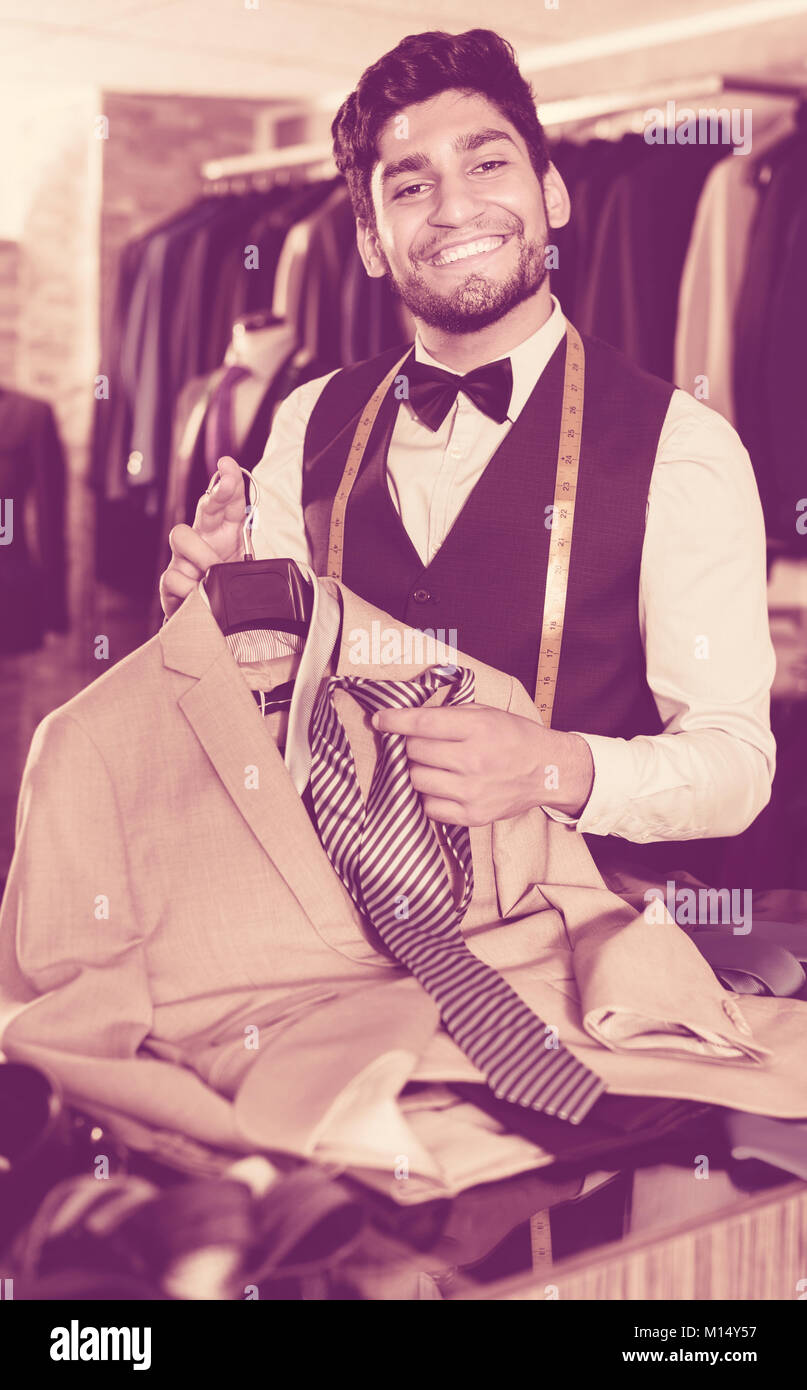 Designer is creating business image in men's apparel shop Stock Photo ...